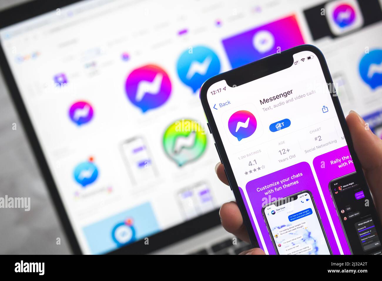 The Messenger app on an iPhone. Woman use messenger application on ...