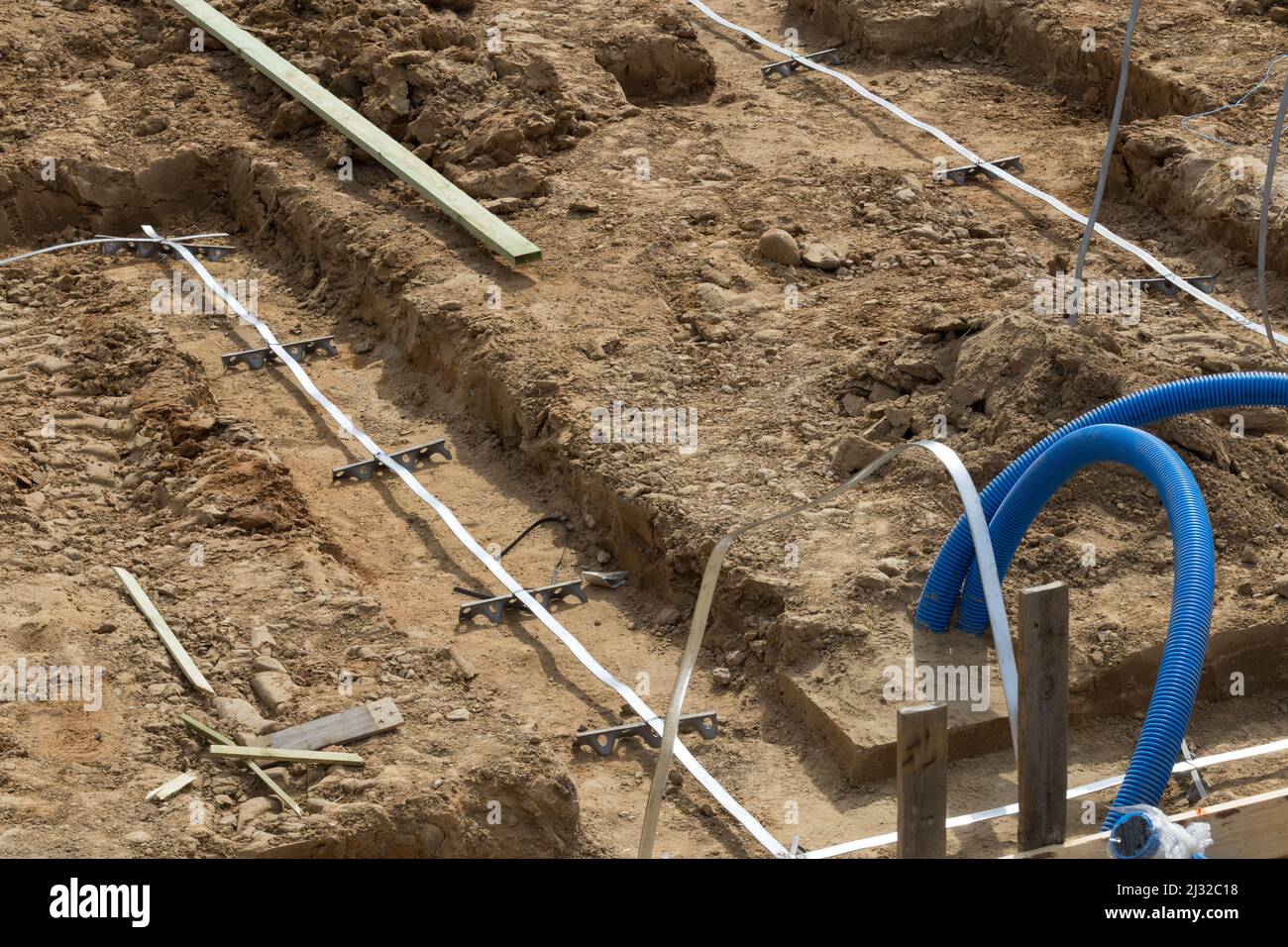 Construction of building. Construction of tenement house. Dug-up trench ...