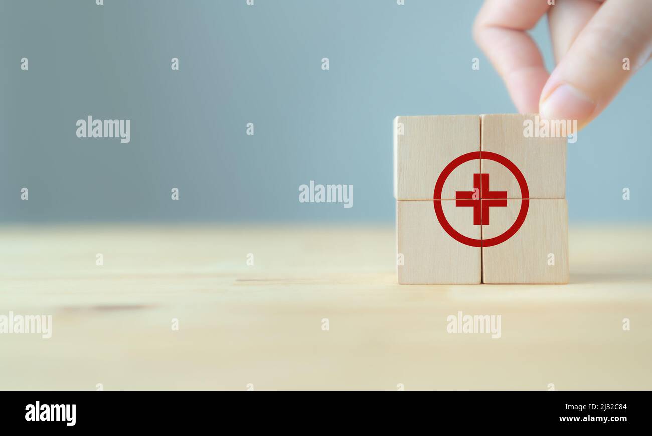 Health and medical treatment concept. The doctor puts the wooden cube ...