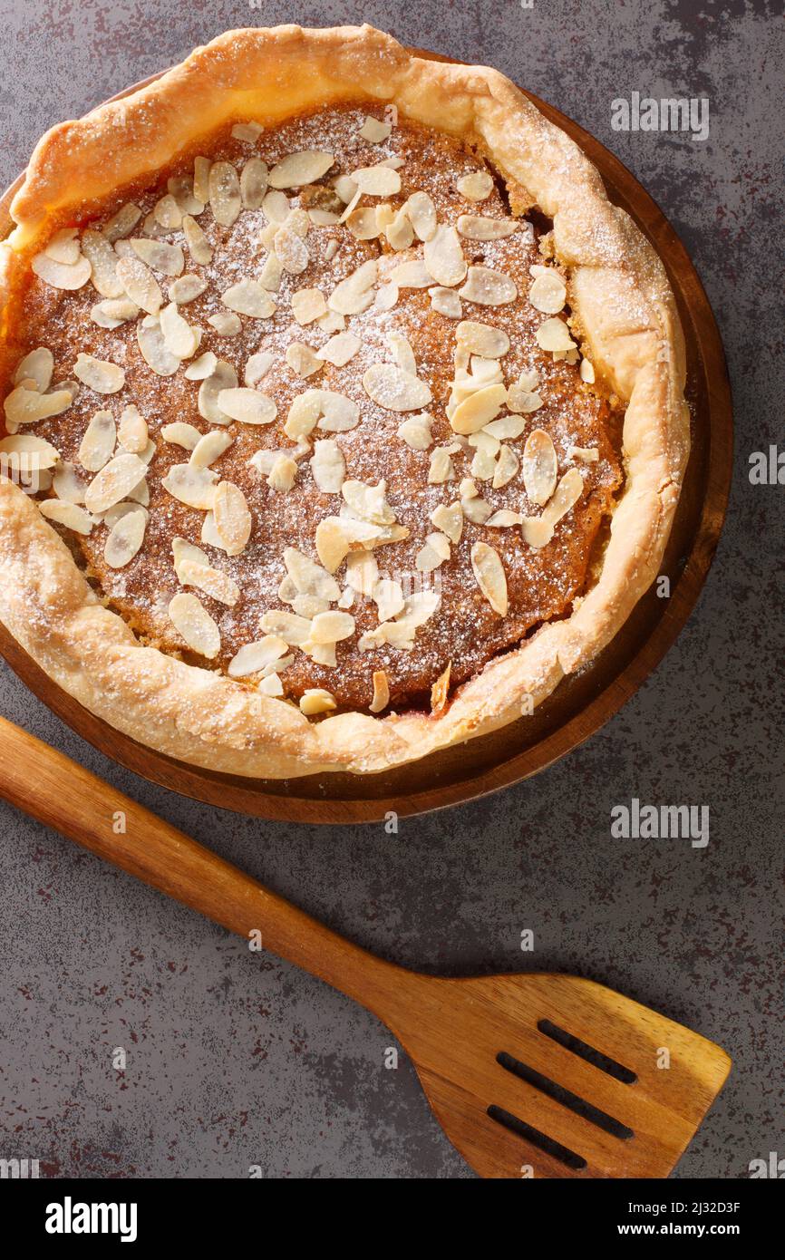 Bakewell Pudding puff pastry cake with jam and almond filling close-up ...