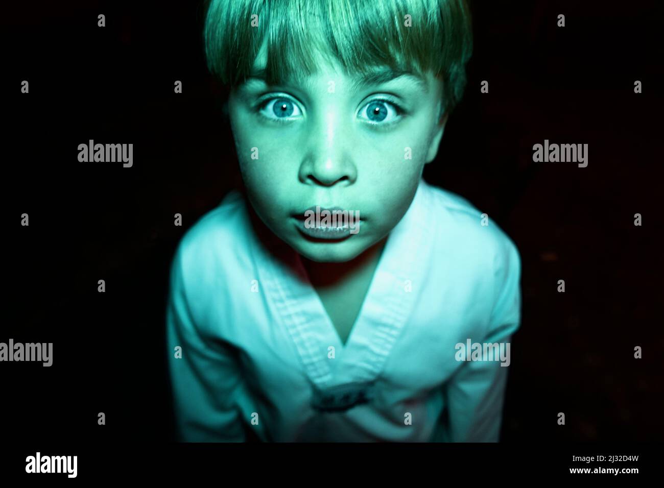 night photography shallow focus boy un Der cyan key light Stock Photo ...