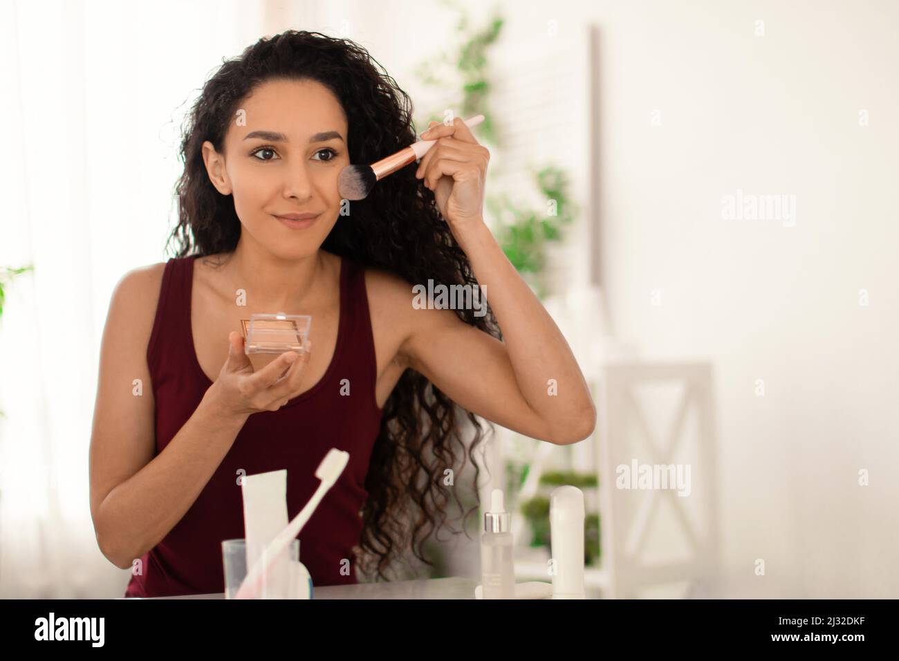 Applying makeup at bathroom mirror hi-res stock photography and images ...
