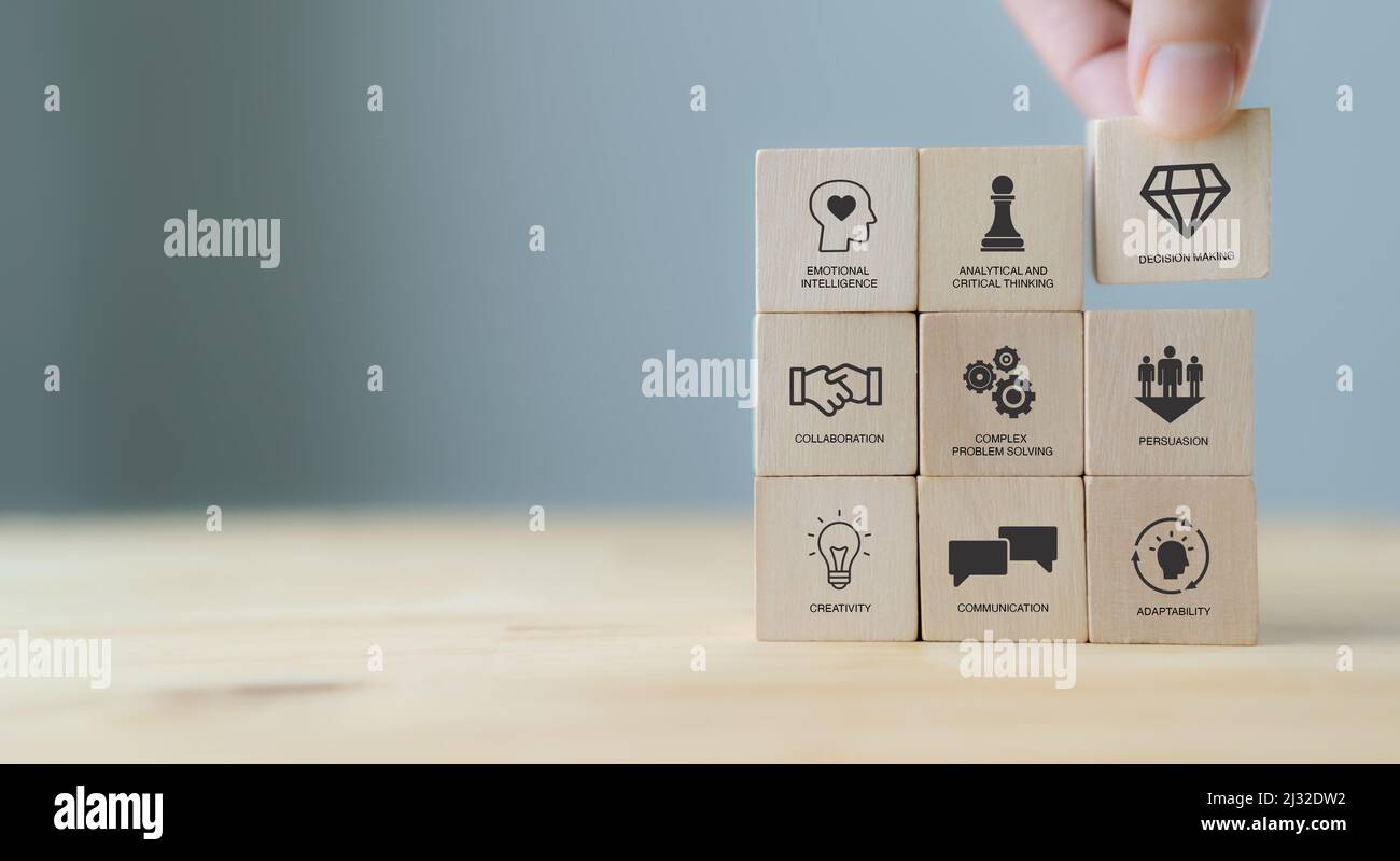 Soft skills concept. Used for presentation, banner. Hand puts wooden cubes with icons of "SOFT ...
