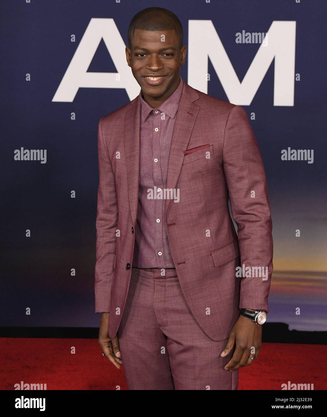 Cedric Sanders arrives at the AMBULANCE Los Angeles Premiere held at ...