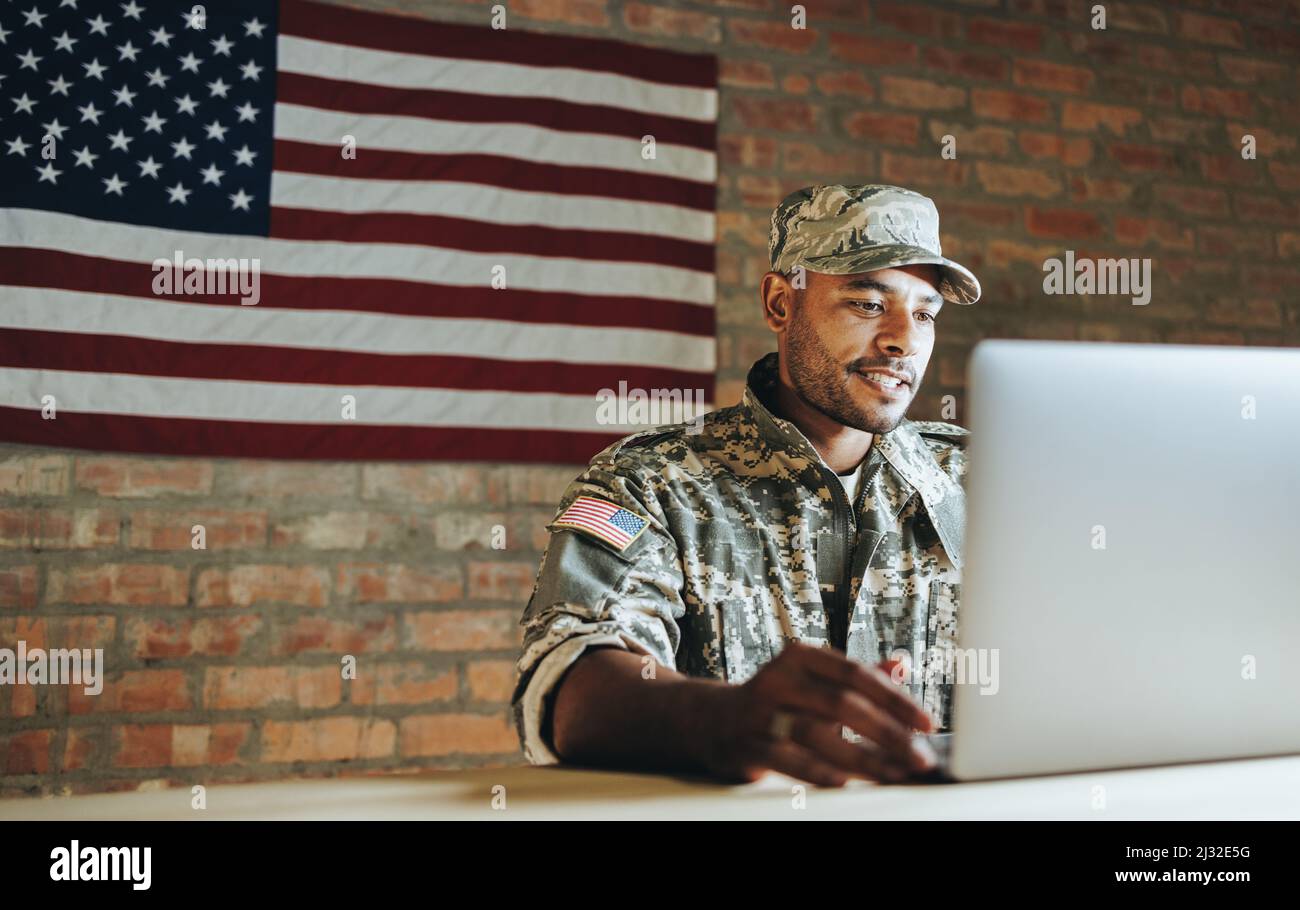 Patriotic young soldier video chatting with his family from the ...