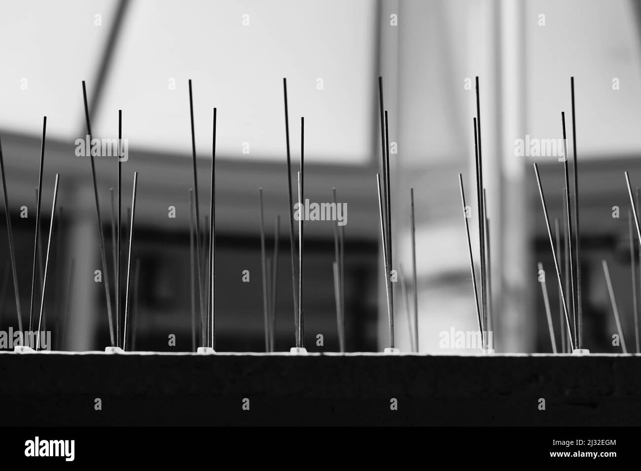 Sharp bird control wires sticking out in a dangerous fashion Stock ...