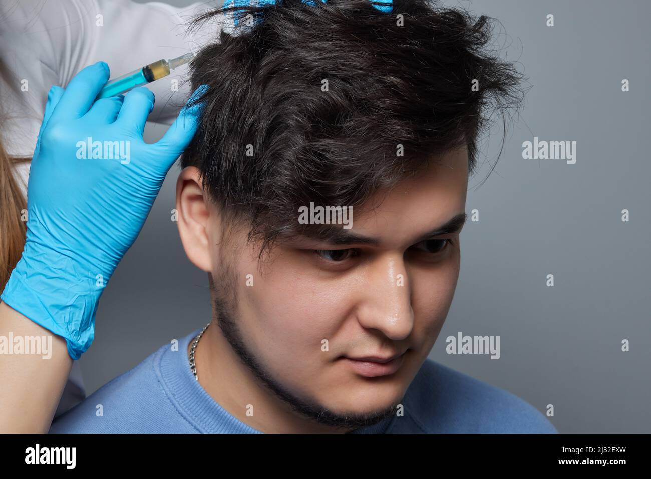 Injection plasma into head hair man cosmetologist doctor Stock Photo ...