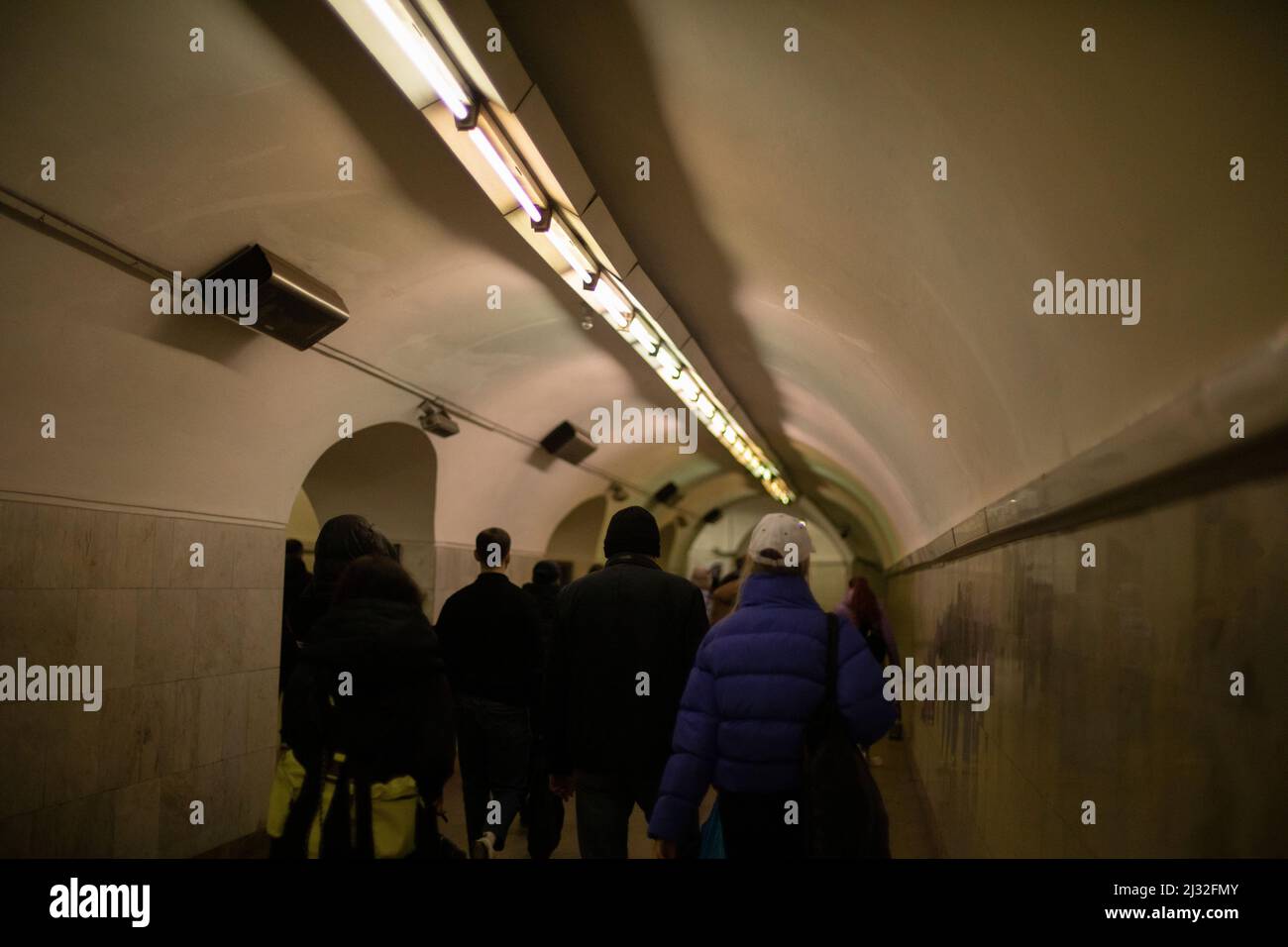 People in tunnel. Moscow Metro. Man under ground. Passengers walk along ...