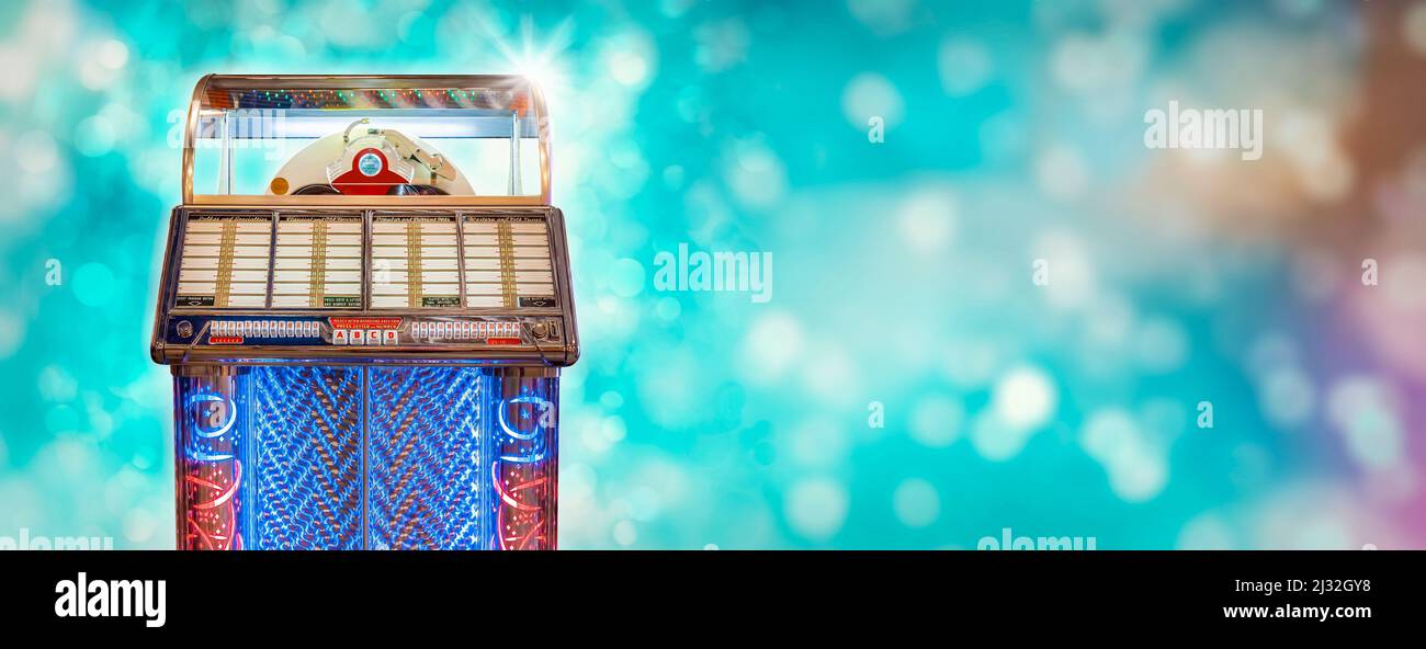 Vintage colorful jukebox in front of blue background with bokeh Stock ...
