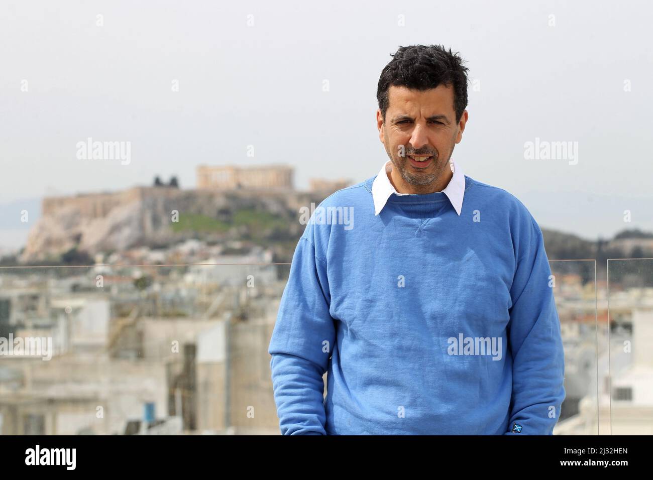 French director SAMIR GUESMI posing with background the Acropolis ...