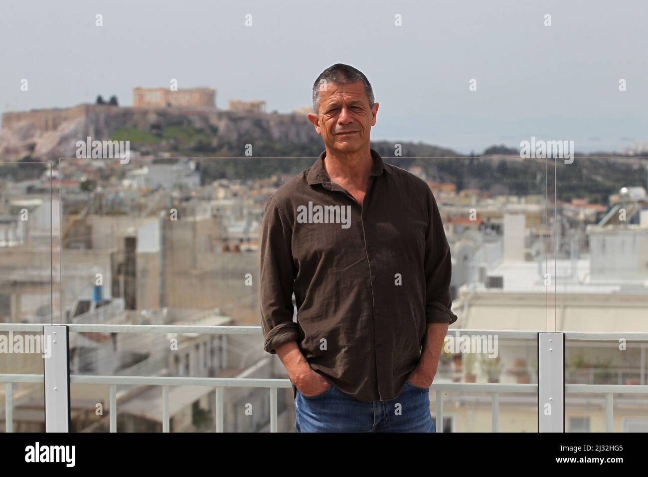 French writer EMMANUEL CARRERE posing with background the Acropolis ...
