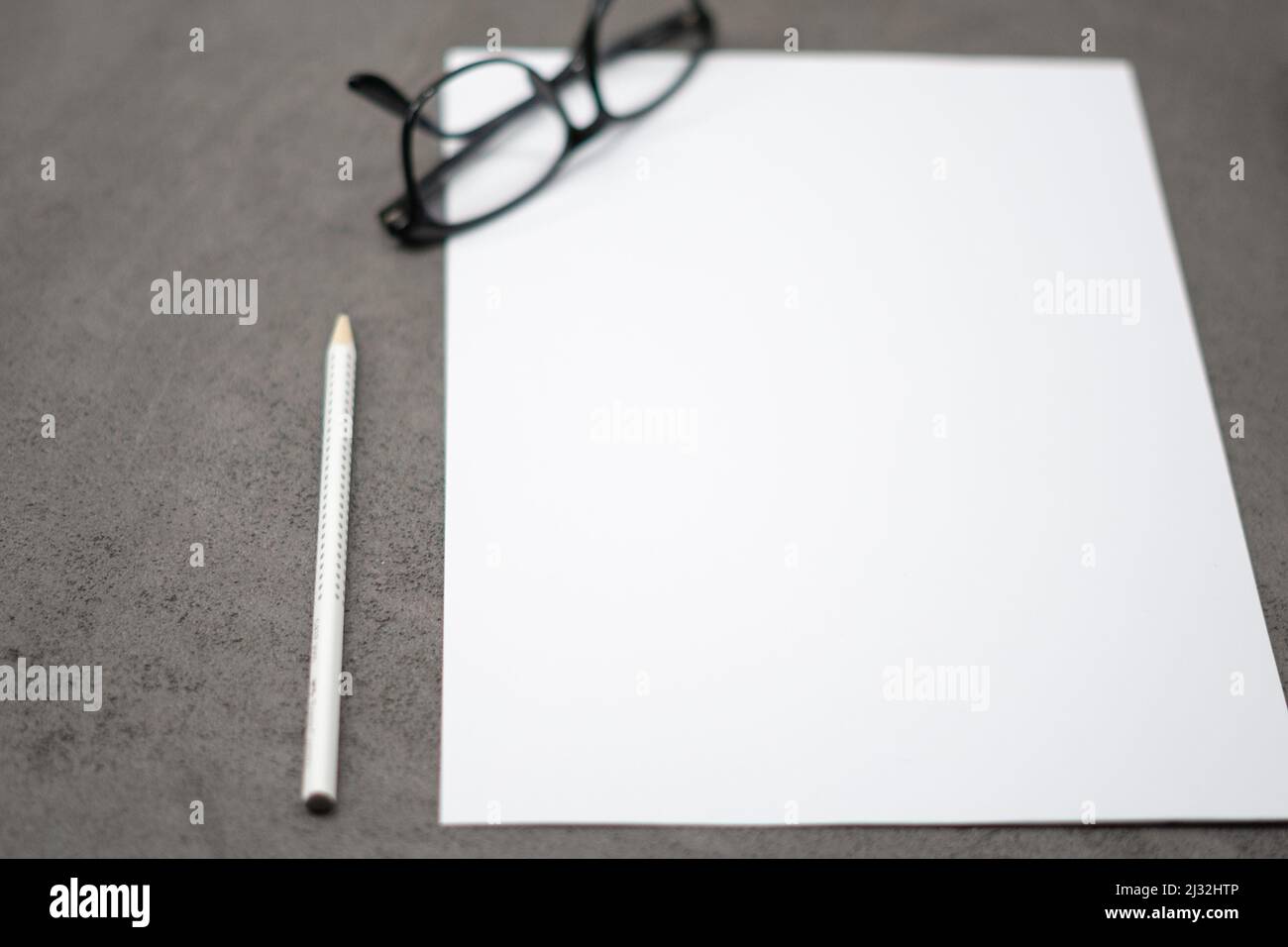 A white paper sheet with pencil Stock Photo - Alamy