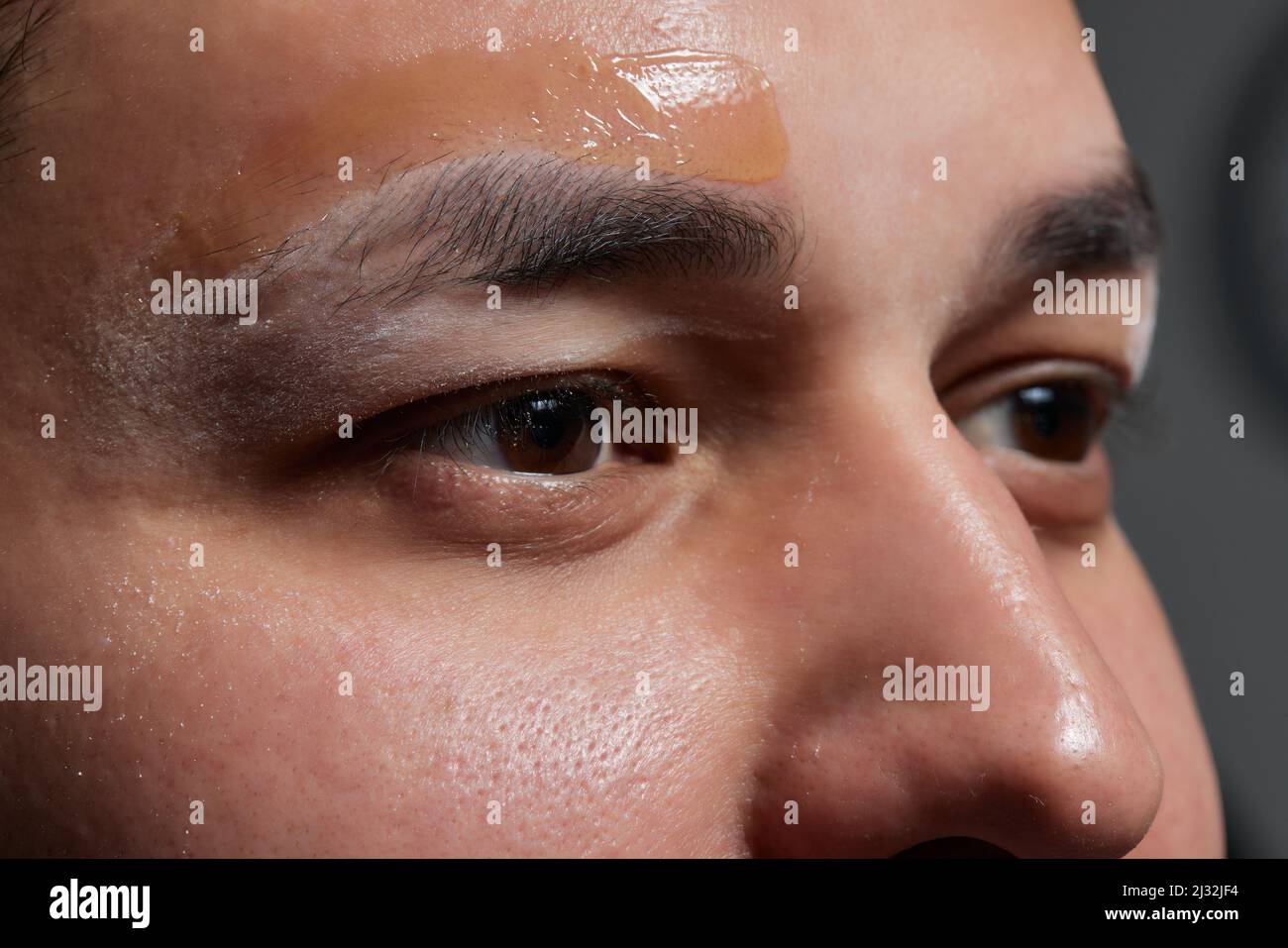 Professional barber doing threading procedure and correcting shape of ...