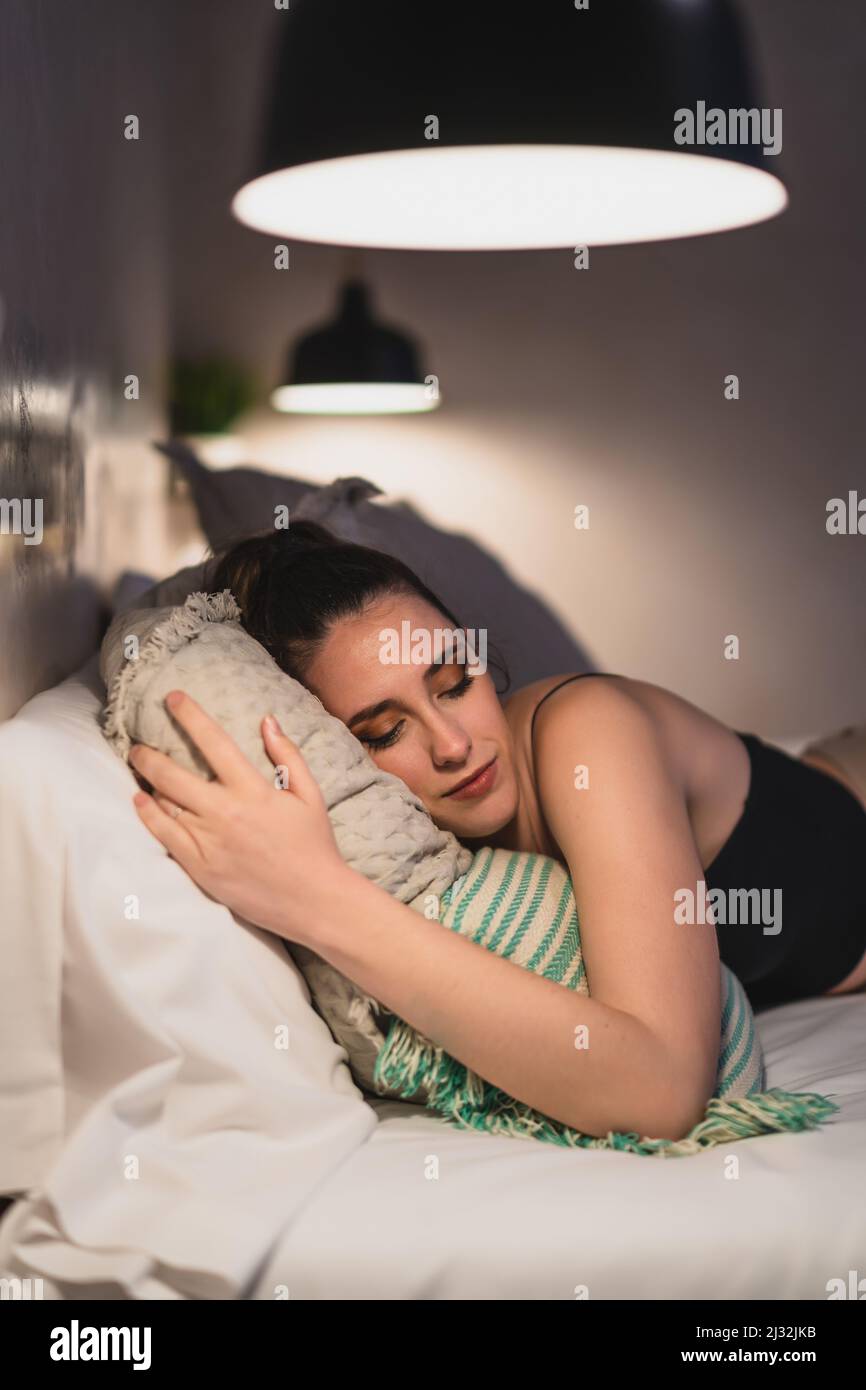 Attractive woman sleeping bed vertical hi-res stock photography and ...