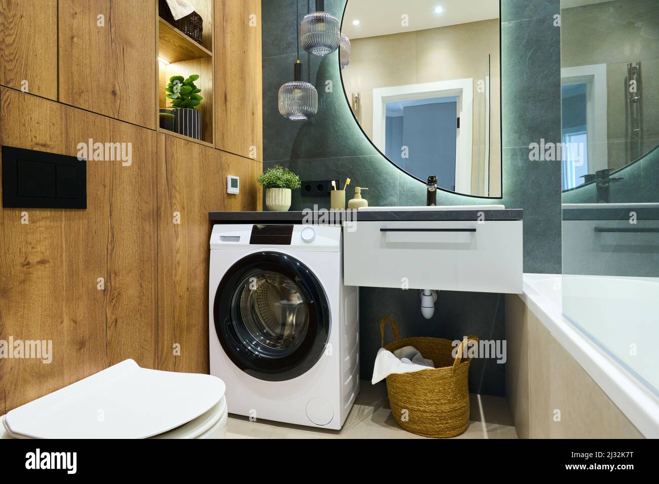 Part of bathroom with mirror, sink, wooden closet, bodycare items and ...