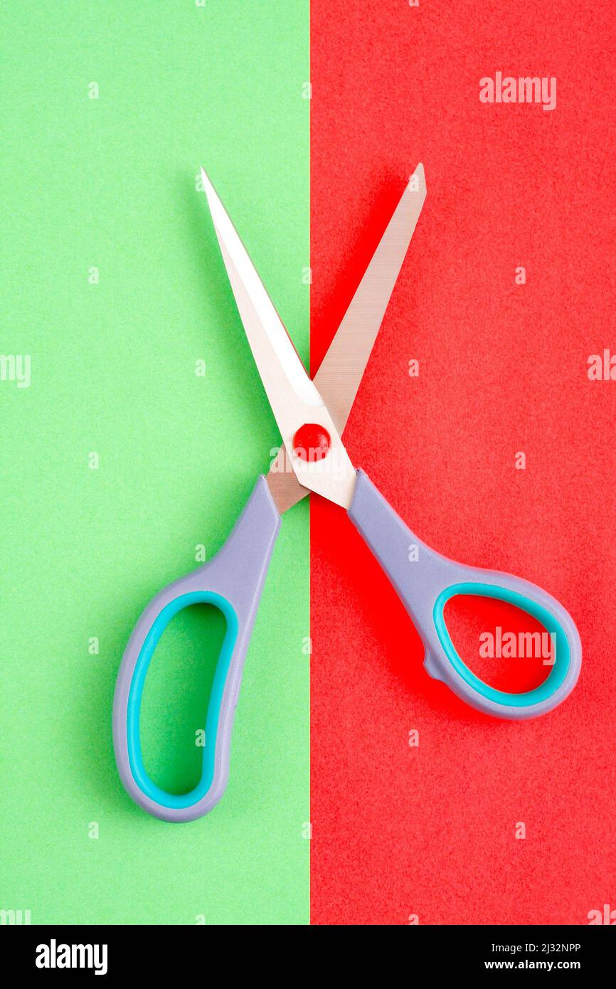 Minimalist image of scissors on red and green background Stock Photo ...