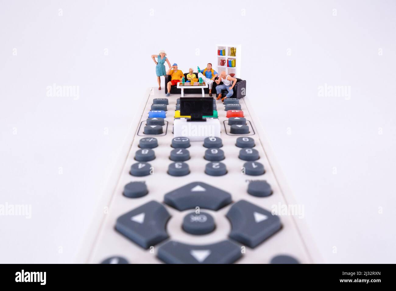 Family spending time together channel surfing and watching a television ...