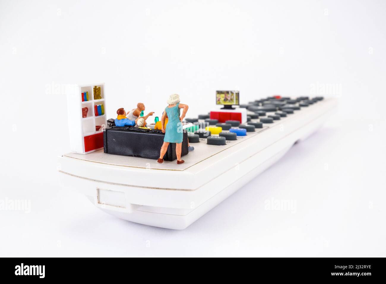 Family spending time together channel surfing and watching a television ...