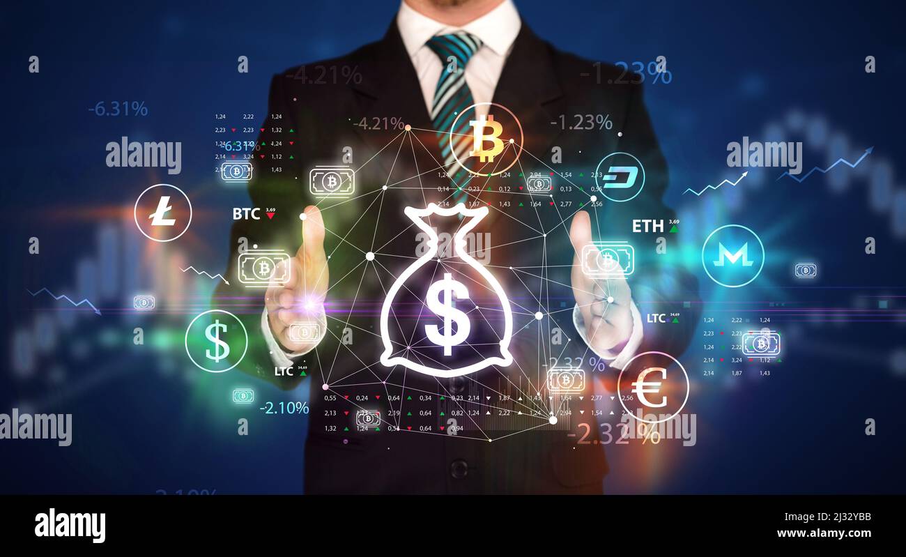 Businessman holding currency symbols concept Stock Photo - Alamy