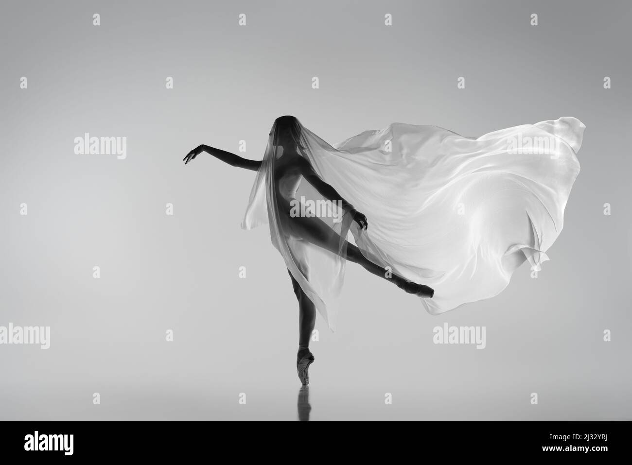 Black and white portrait of graceful ballerina dancing with fabric ...