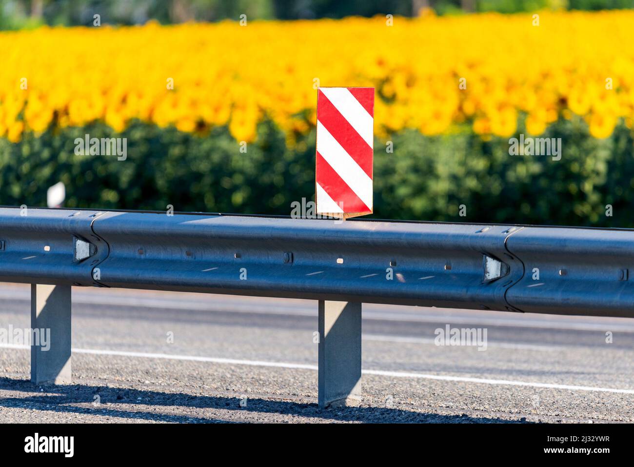 Red and white stripes traffic sign on center of highway Stock Photo - Alamy