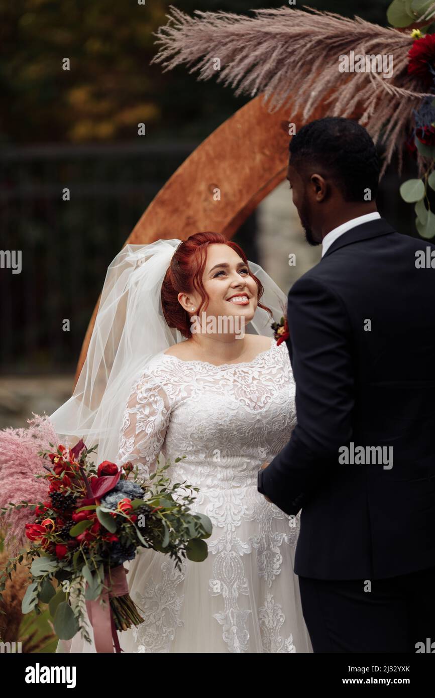 Gorgeous white woman with charming African American man stand near ...