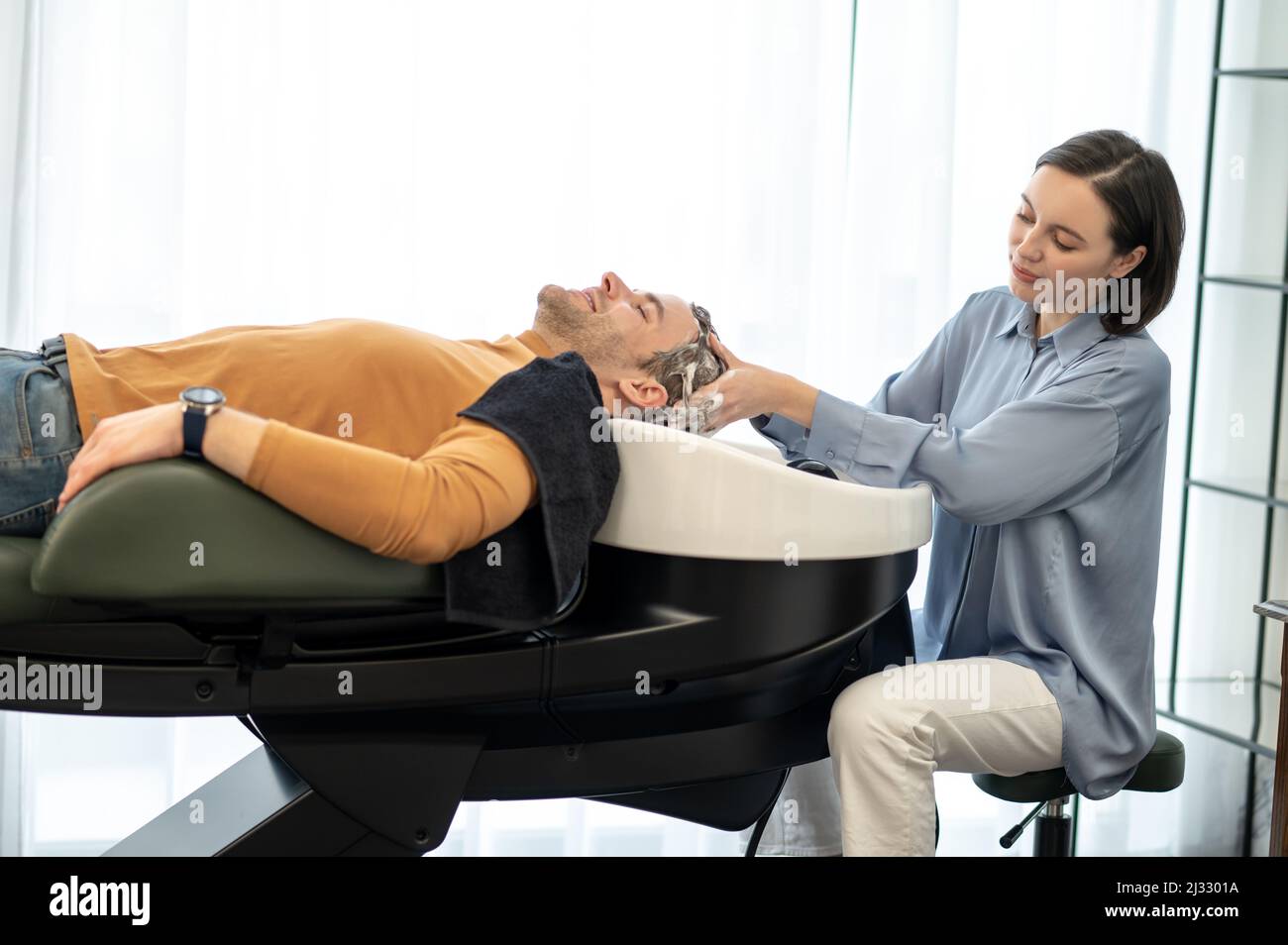 Customer sitting in salon chair hi-res stock photography and images - Alamy