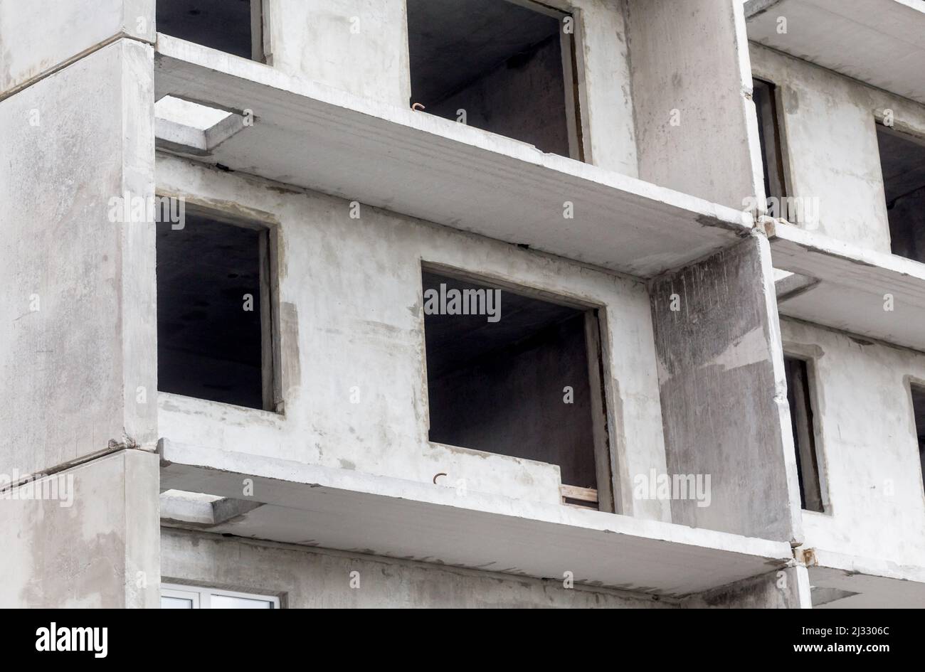 Facade of a modern building under construction. Multi-storey ...
