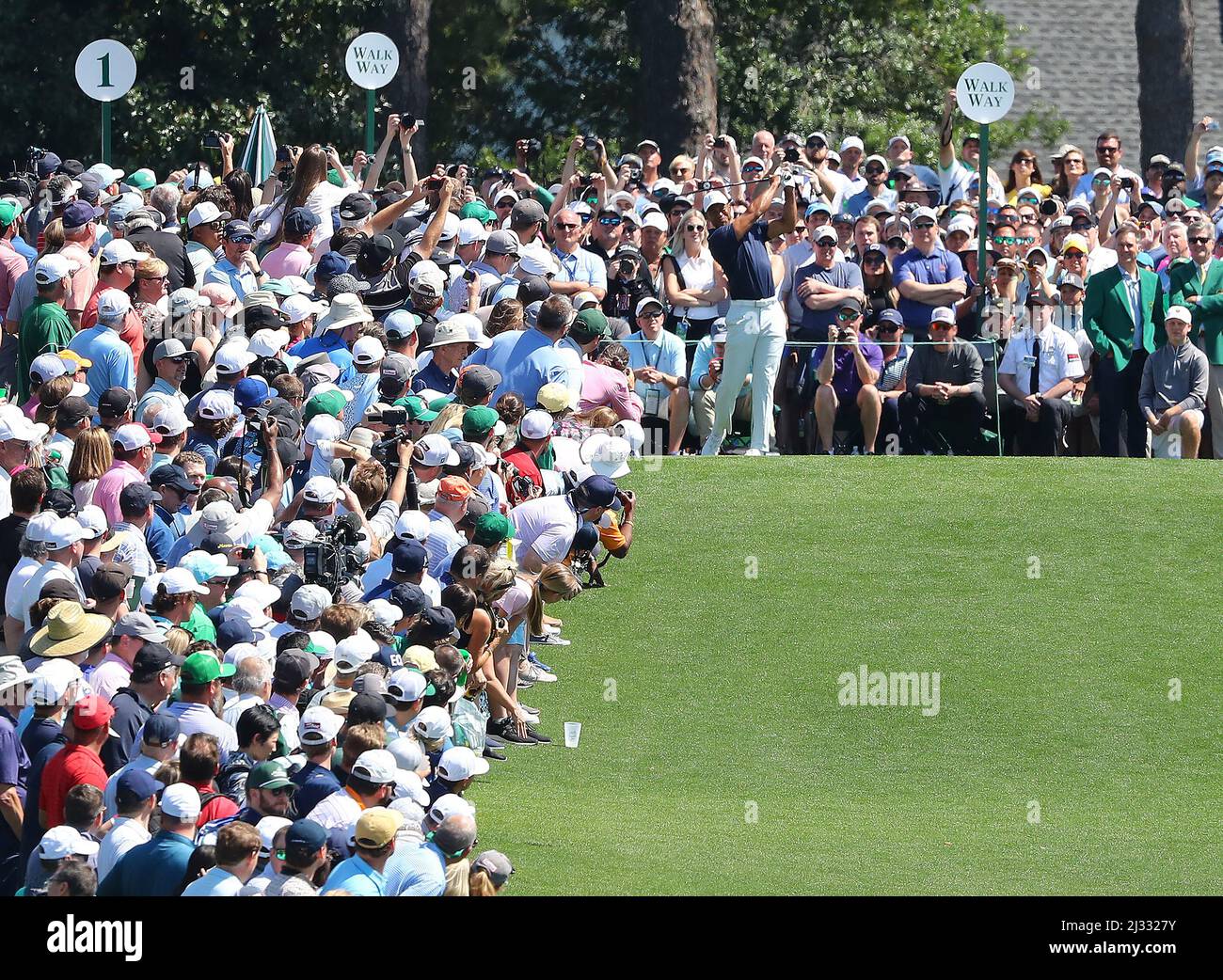 The gallery of patrons packs around the first tee watching five-time ...
