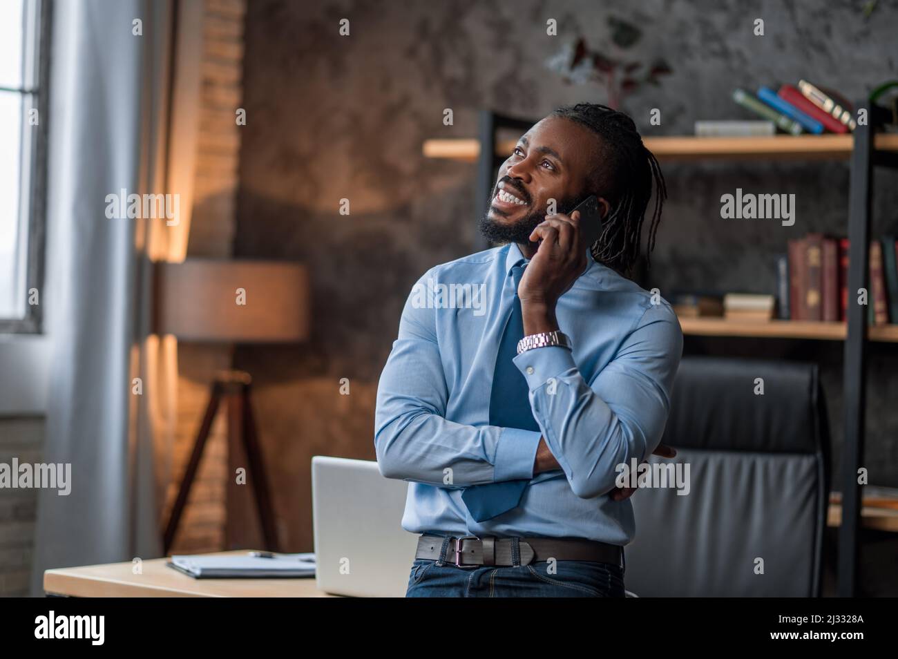 Cheerful african american employee chatting hi-res stock photography ...