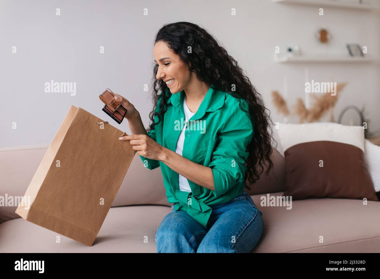 Business female unpacking shopping bag hi-res stock photography and ...
