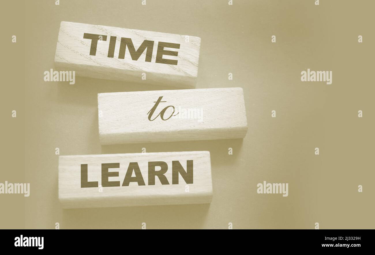 Time to Learn on wooden blocks put black. Education concept. Life-time ...