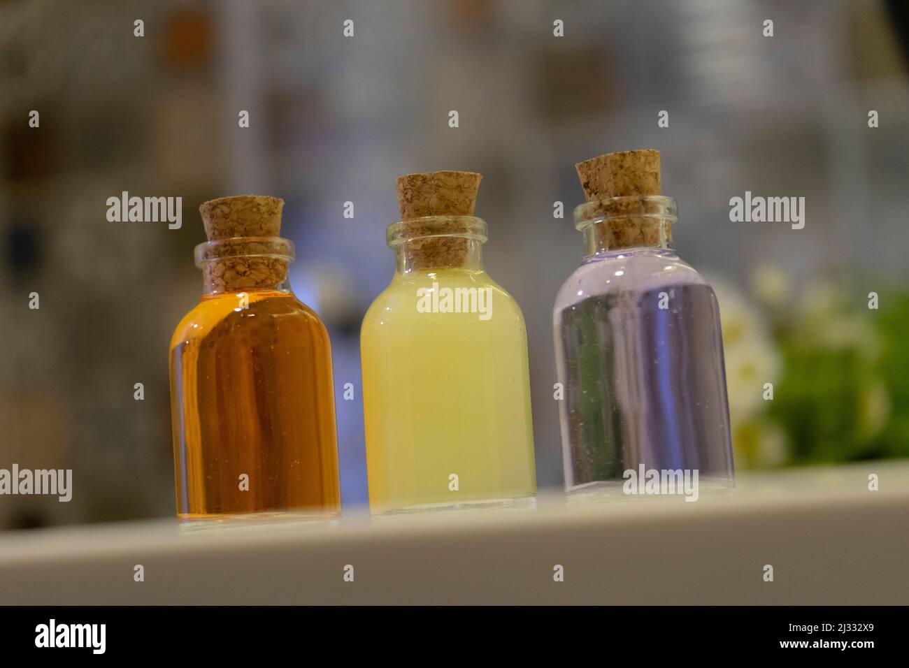 Small, colored shampoo bottles Stock Photo - Alamy