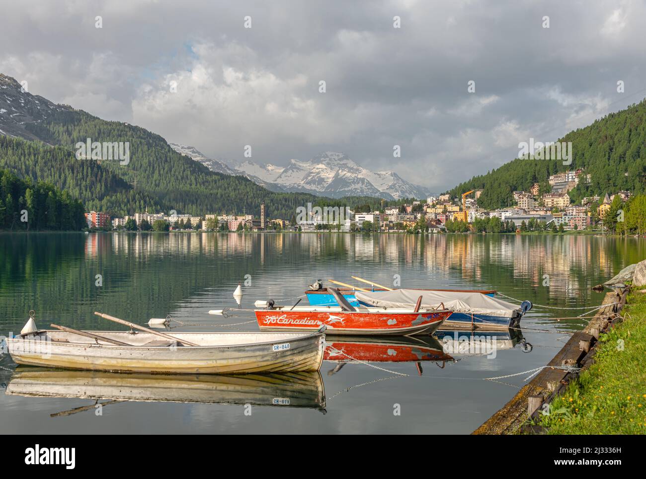 Rowing boats on Lake St. Moritz in spring with St. Moritz Bad in the ...