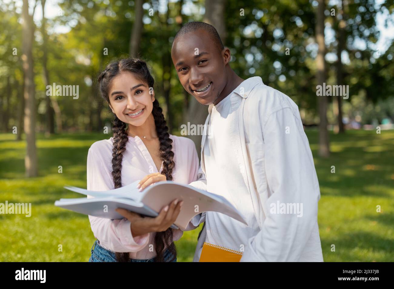 Education concept. Friendly multiracial university students preparing ...