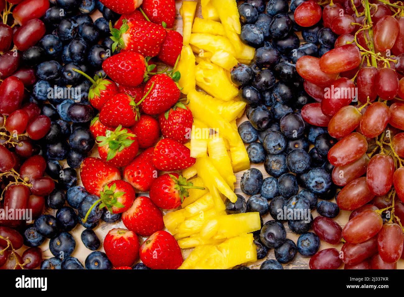 Fresh fruits background, Arrangement in row of grapes assorted berries ...