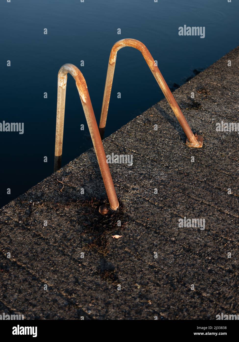 A handrail on a small jetty in Connemara, County Galway, Ireland Stock ...