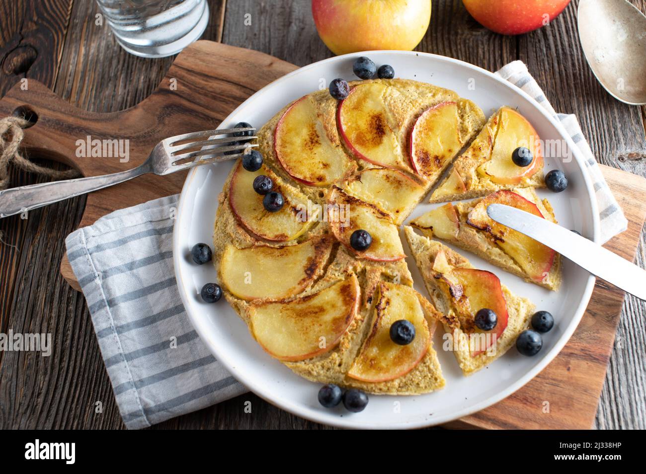 Oatmeal pancake with apples for healthy breakfast. Closeup and top view ...