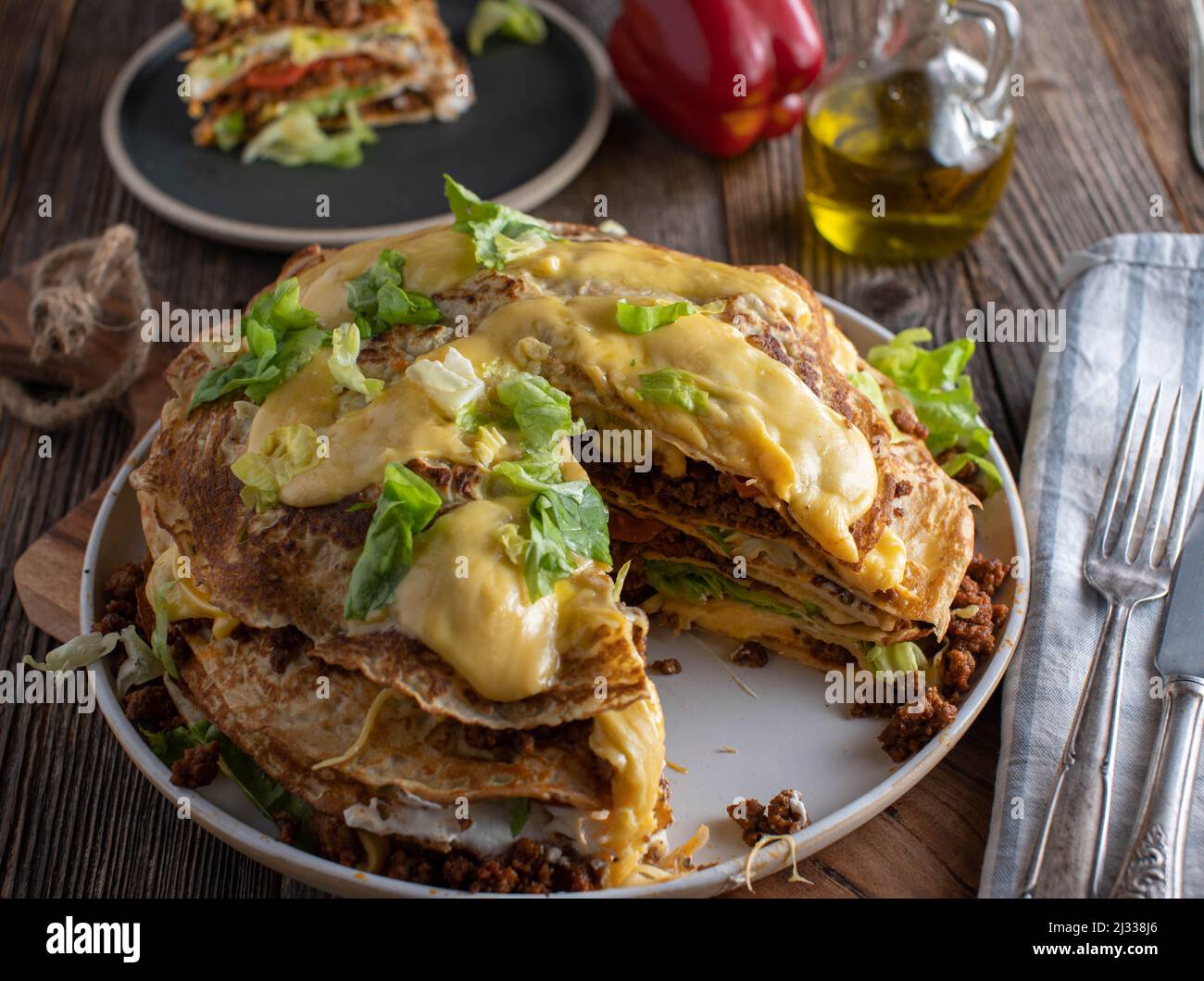 Savory pancake stack, tex mex style with ground beef, beans, tomatoes ...