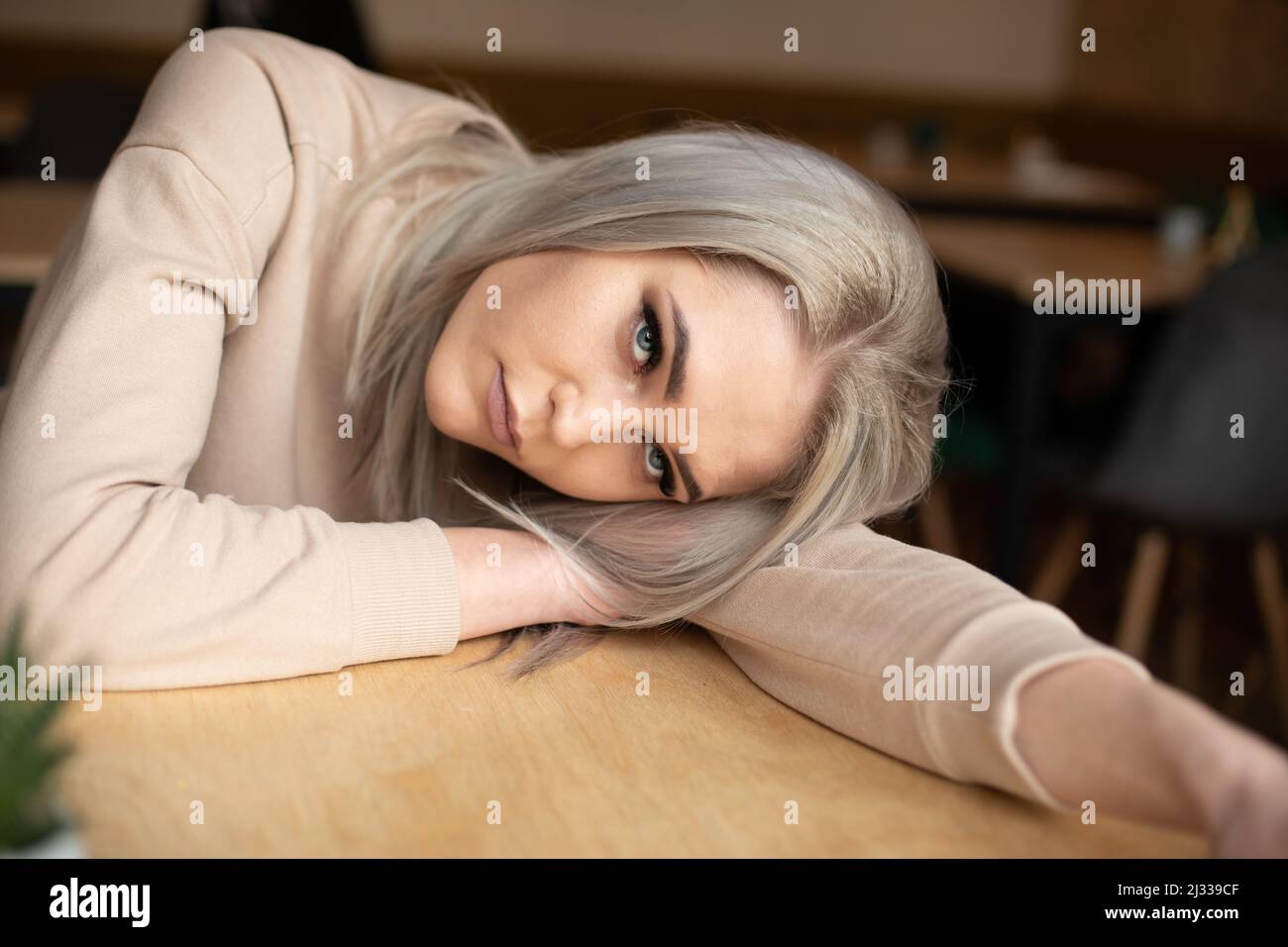 Portrait of young gorgeous thoughtful woman with long grey hair with ...