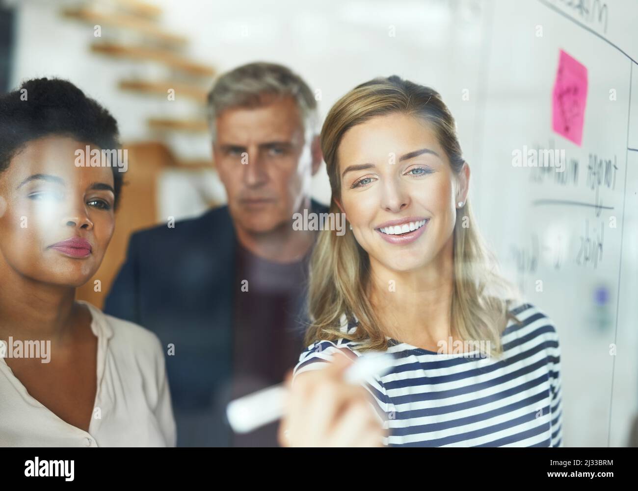 Eager to get behind a winning plan. Shot of a group of colleagues having a brainstorming session ...