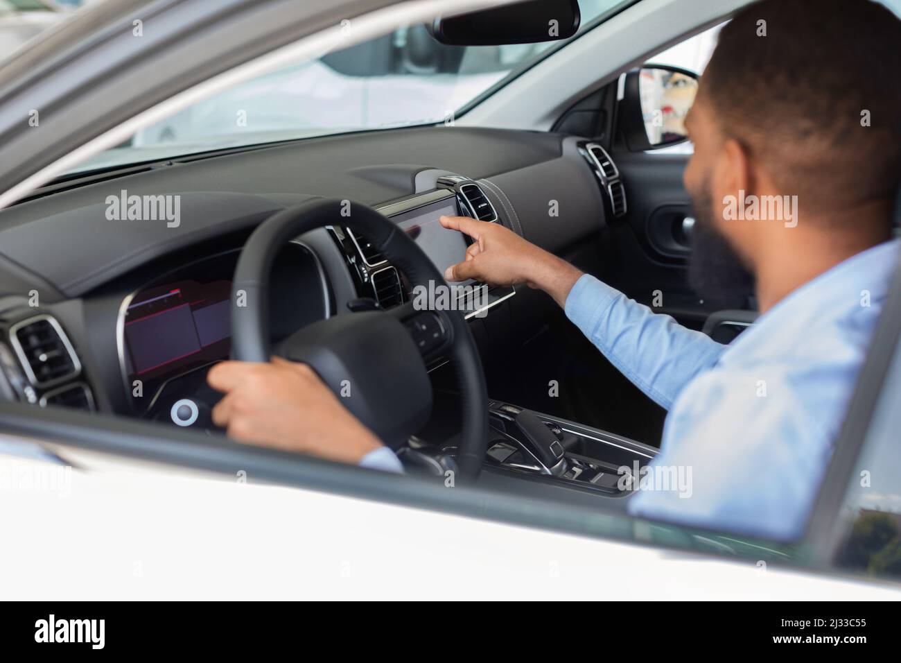 Black Man Choosing New Car In Auto Salon, Touching Multimedia Screen ...