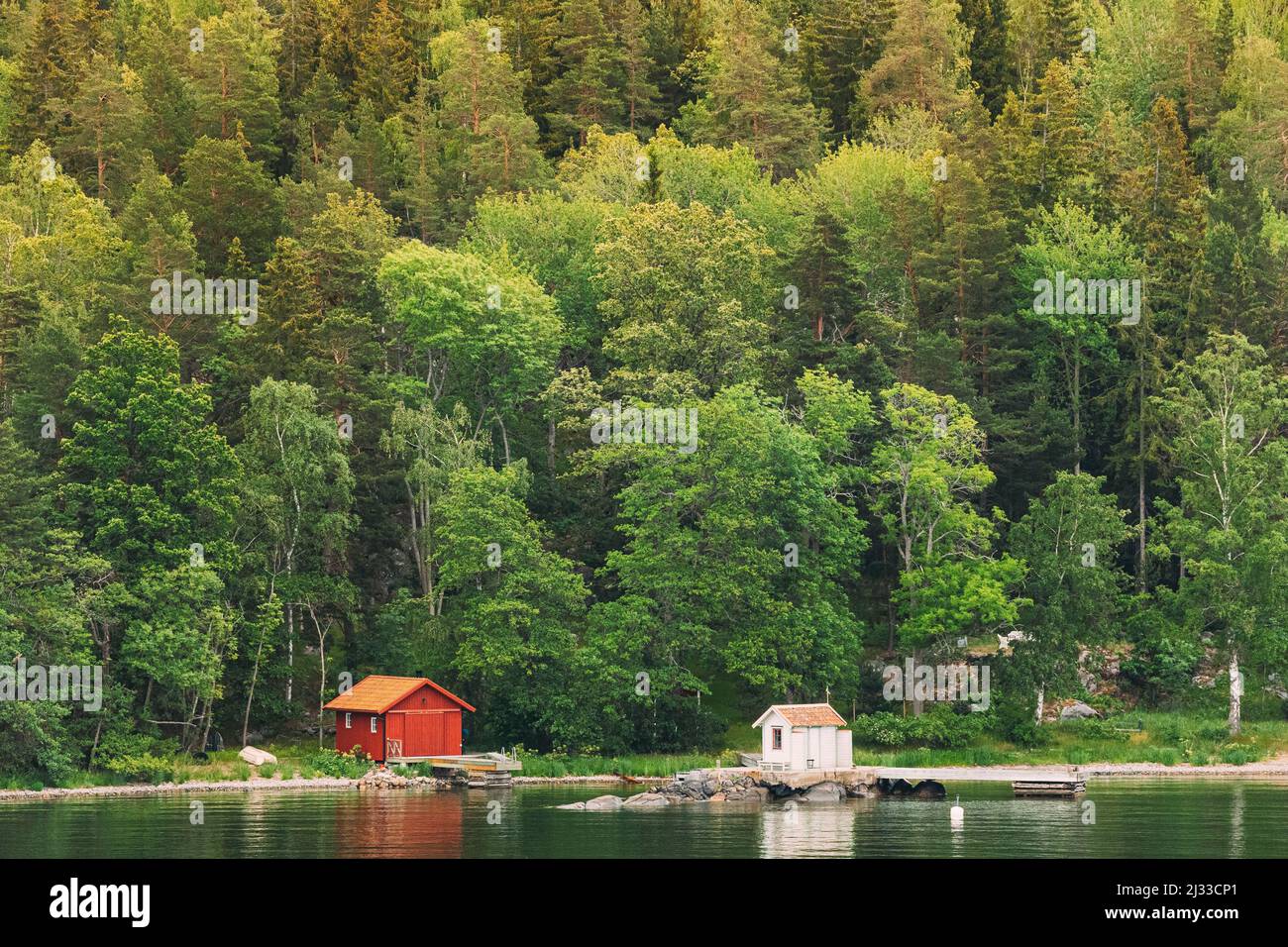 Sweden. Beautiful Red Swedish Wooden Log Cabin House On Rocky Island ...