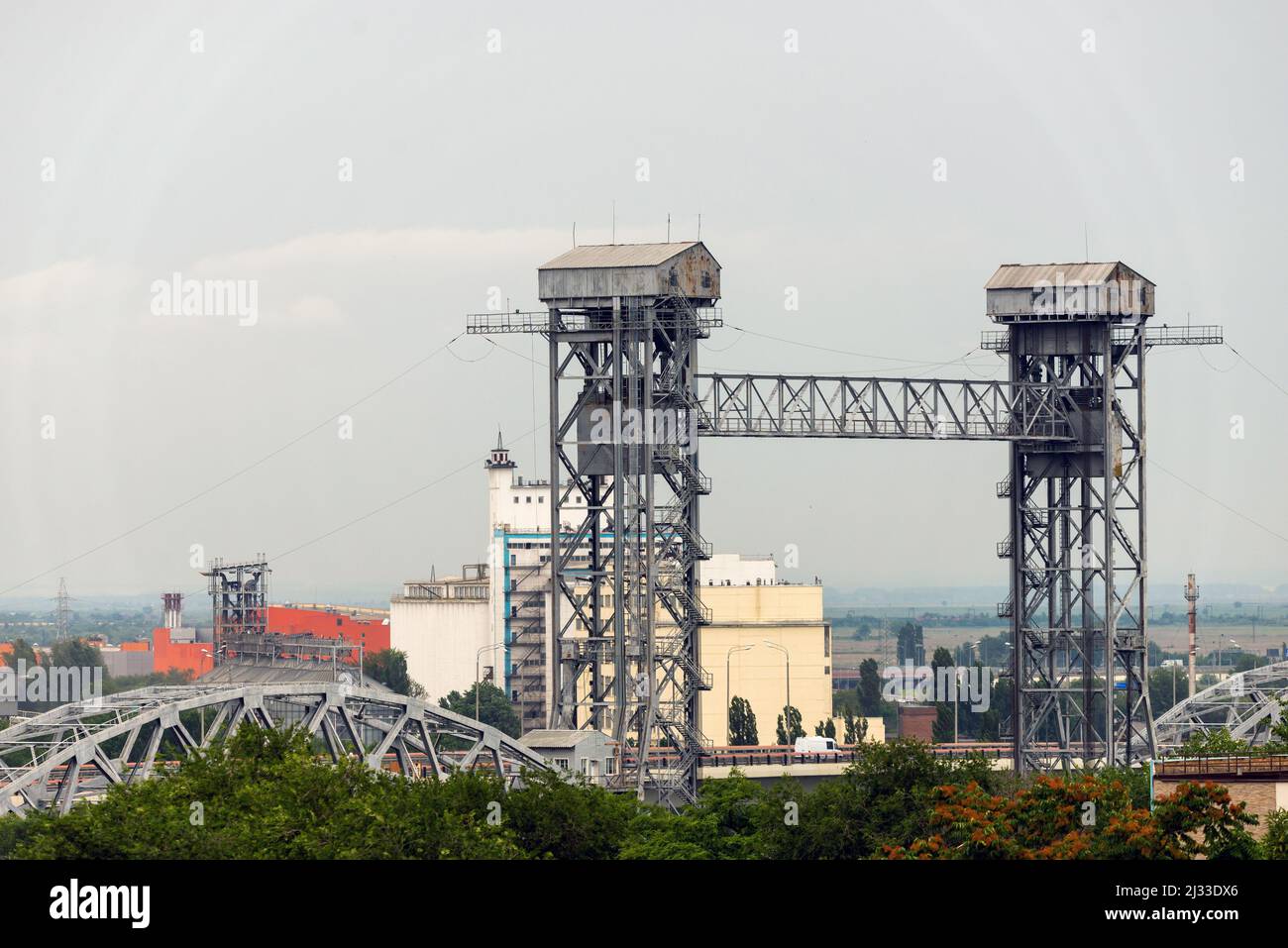 Towers of a rising steel bridge. industrial landscape Stock Photo - Alamy