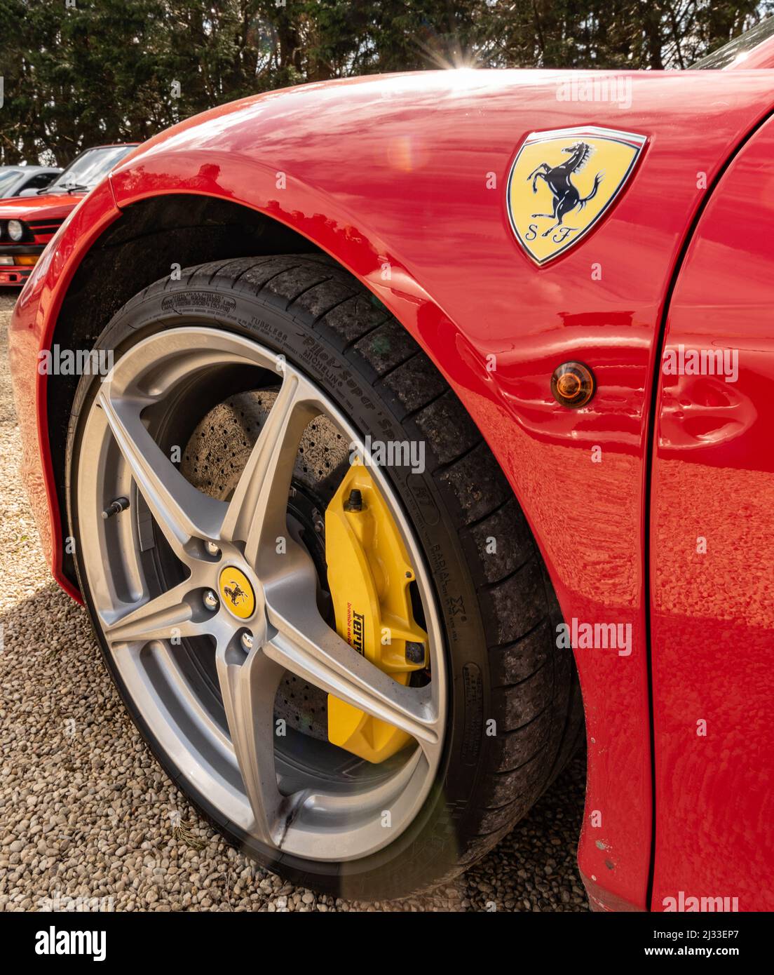 Close up of a Ferrari wheeel showing Ferrari motif and disc brakes ...