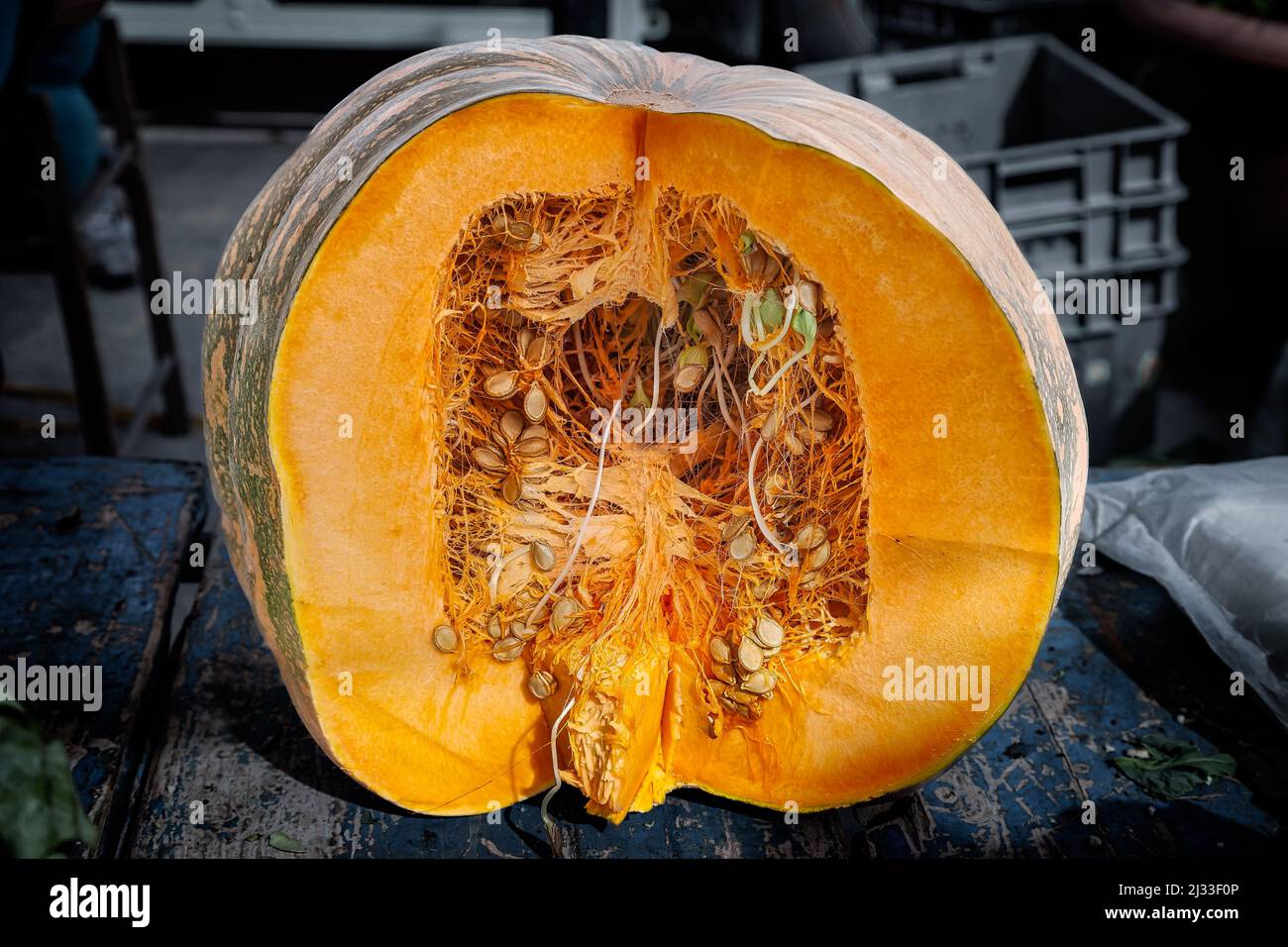 Pumpkin cut in half on a farmers market Stock Photo - Alamy