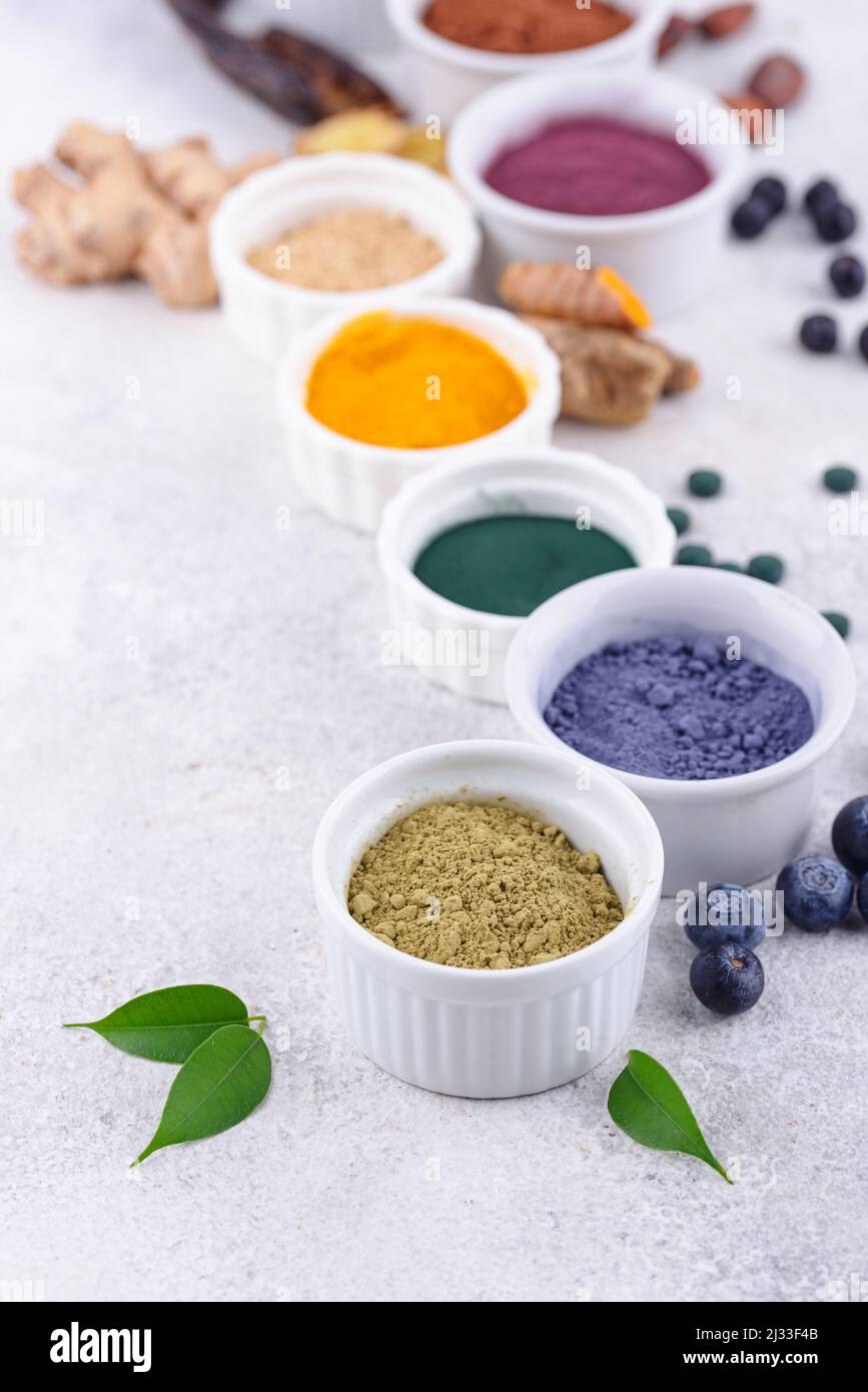 Various healthy superfoods powder Stock Photo - Alamy