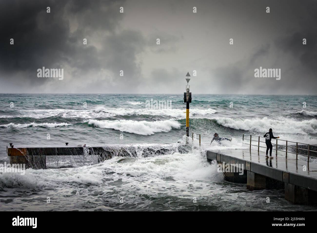 two persons in danger of drowning in the ocean wave Stock Photo - Alamy