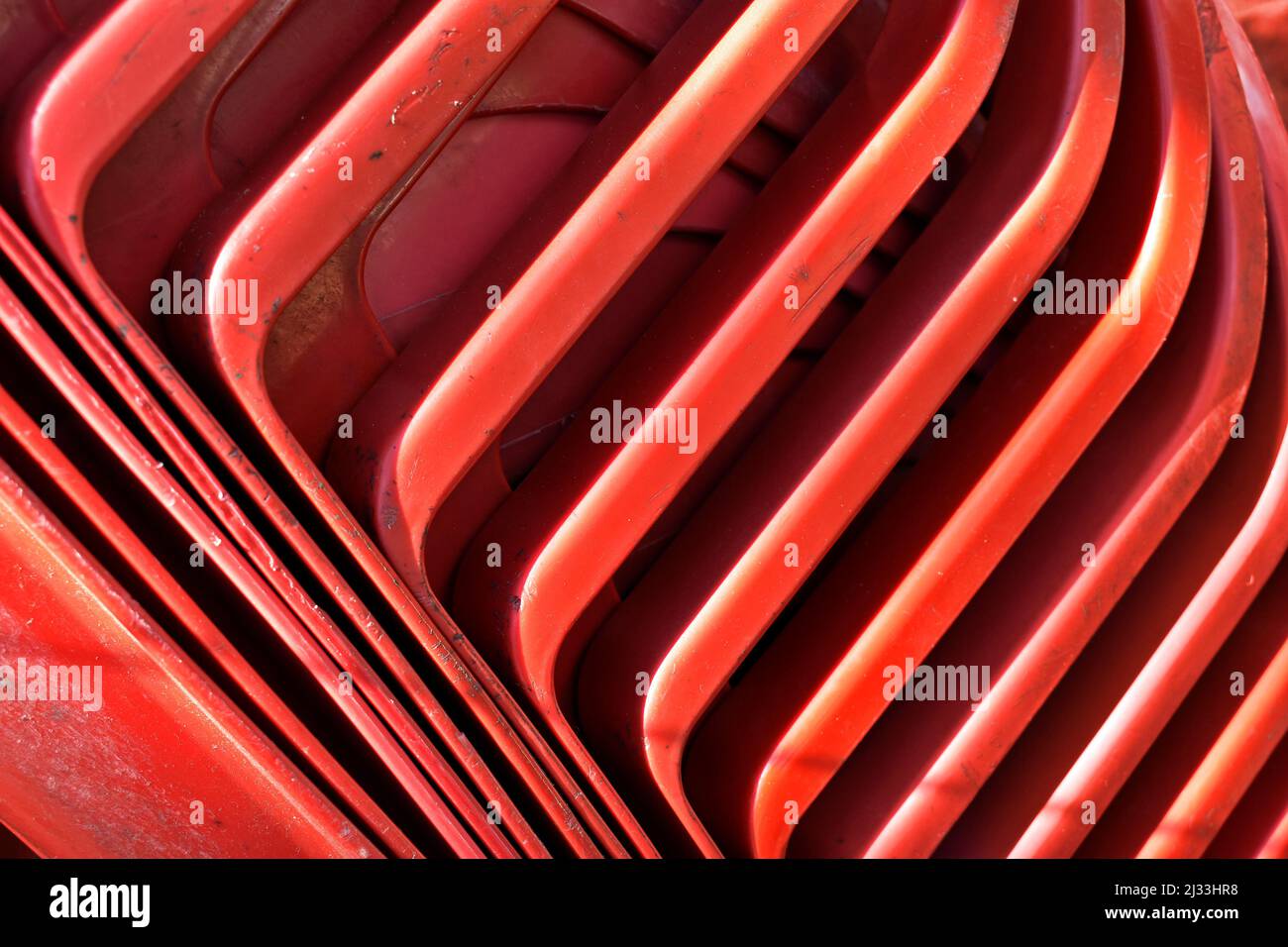 Stacked red plastic chairs, Rio Stock Photo - Alamy