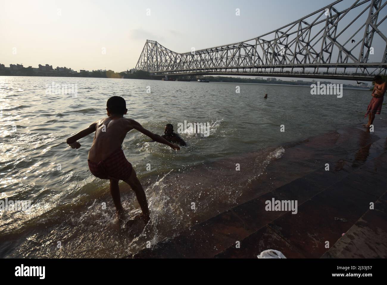 Bathing boys in the Ganges near the Howrah Bridge. Mullick Ghat ...